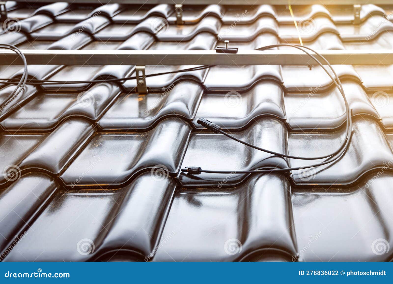 Solar Panel Cables and Mounting System on a Tiled Roof Stock Photo ...