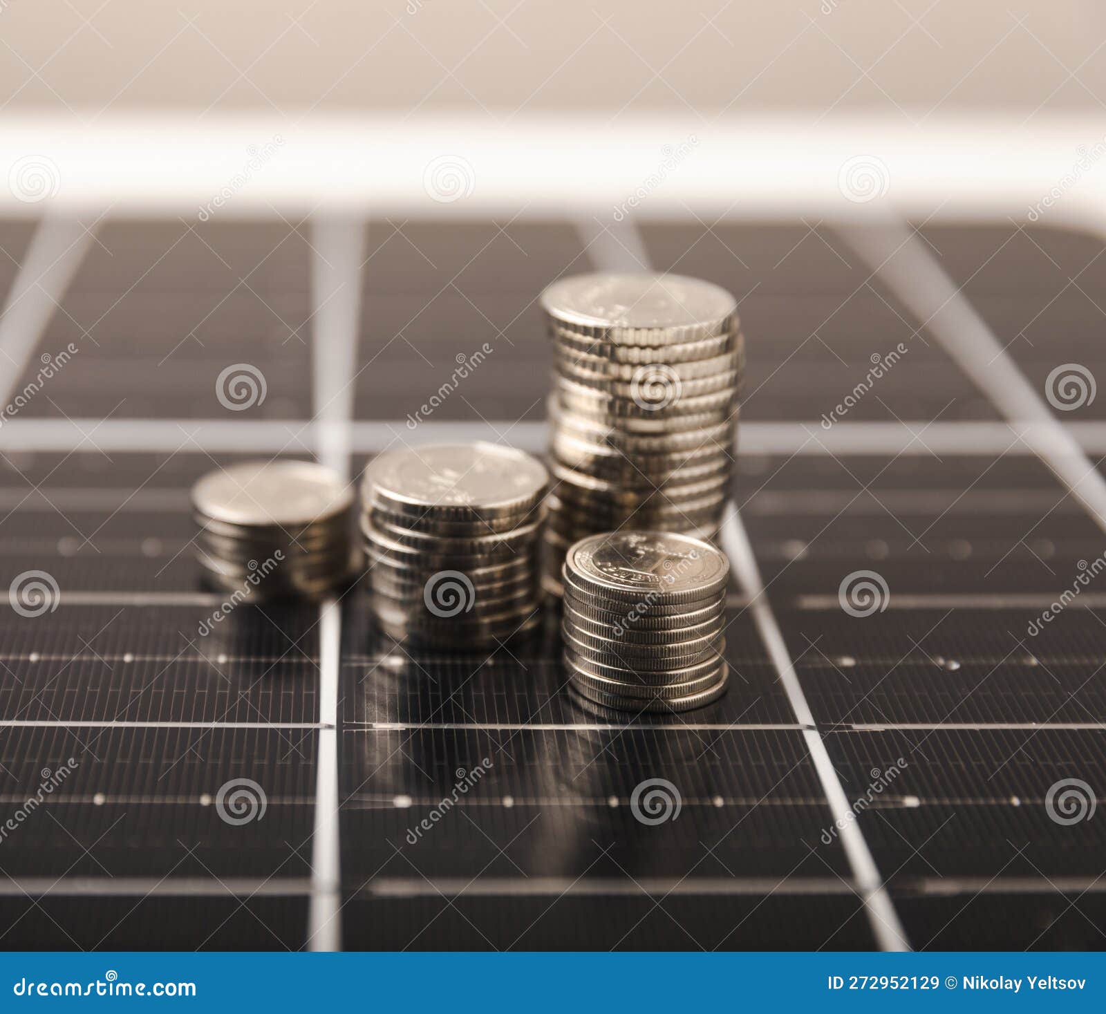 Solar Panel and Coins. Concept of Saving Money and Clean Energy Stock ... Solar Panel and Coins. Concept of Saving Money and Clean Energy Stock ...
