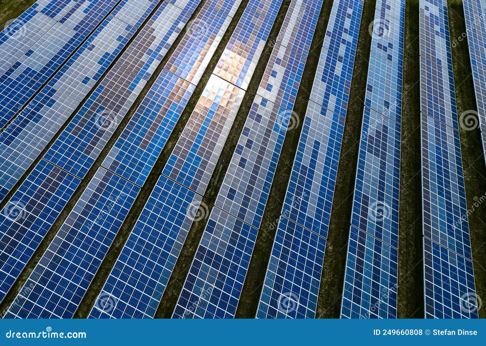 Solar Panel Field at Work with Sun Reflection Stock Photo - Image of ...