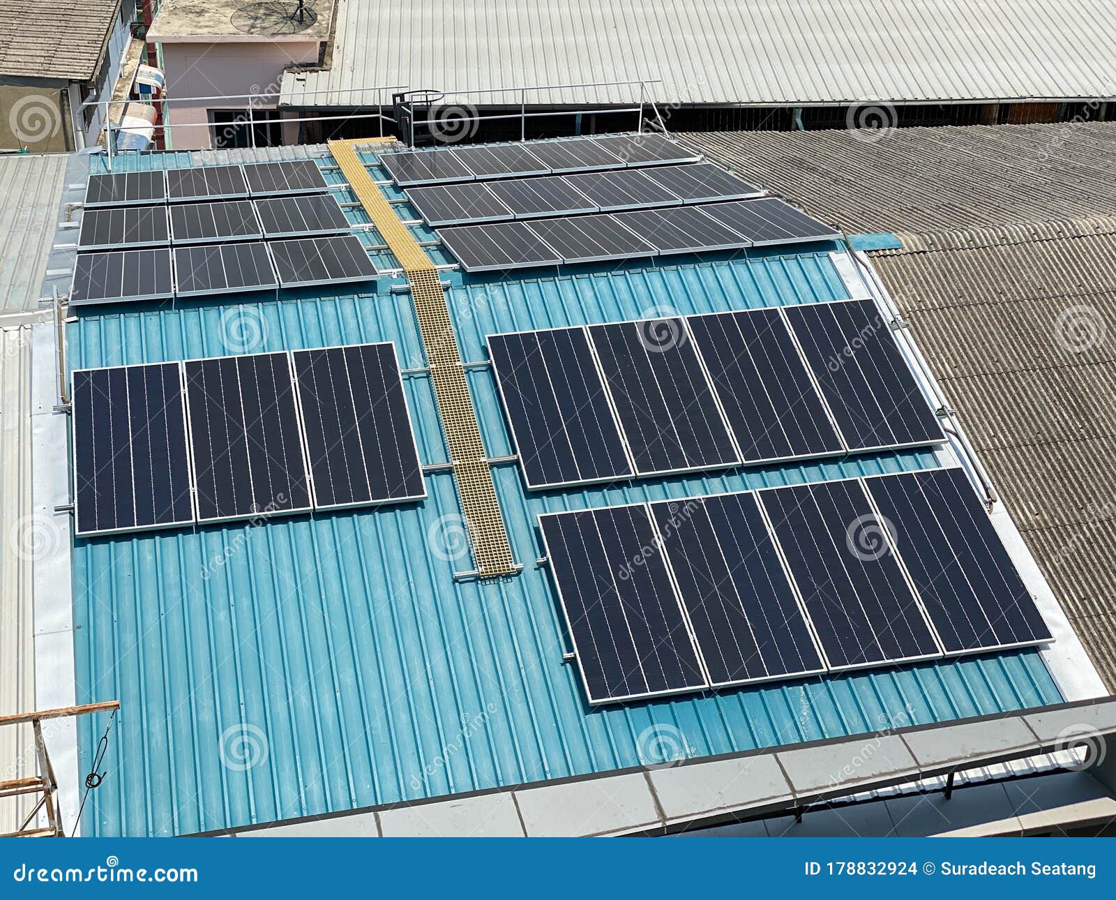 Solar Panel Installed on a Blue Roof Top House Stock Photo - Image of ...