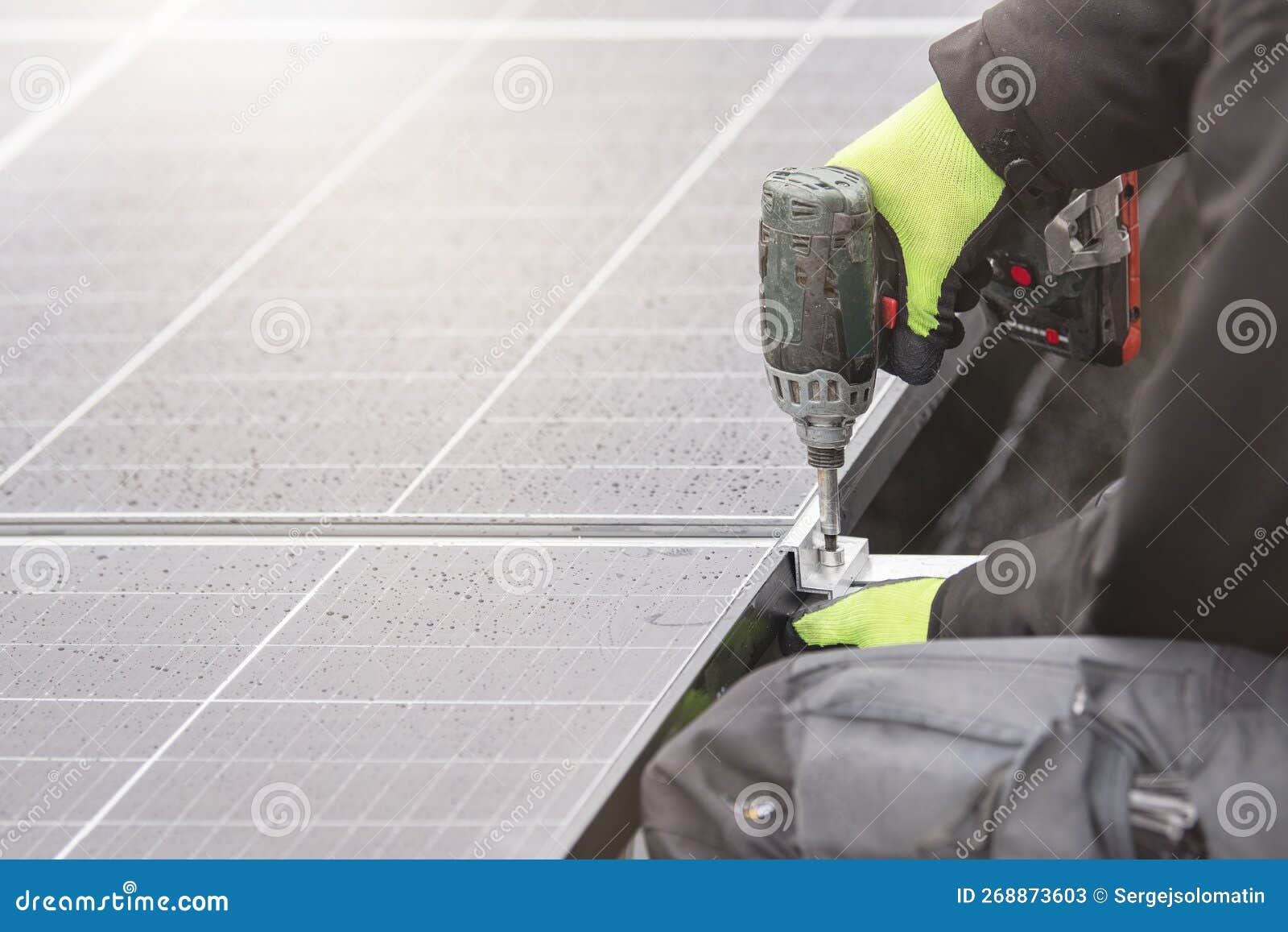 The Solar Panel Installer Twists the Modules Together Using Aluminum ...