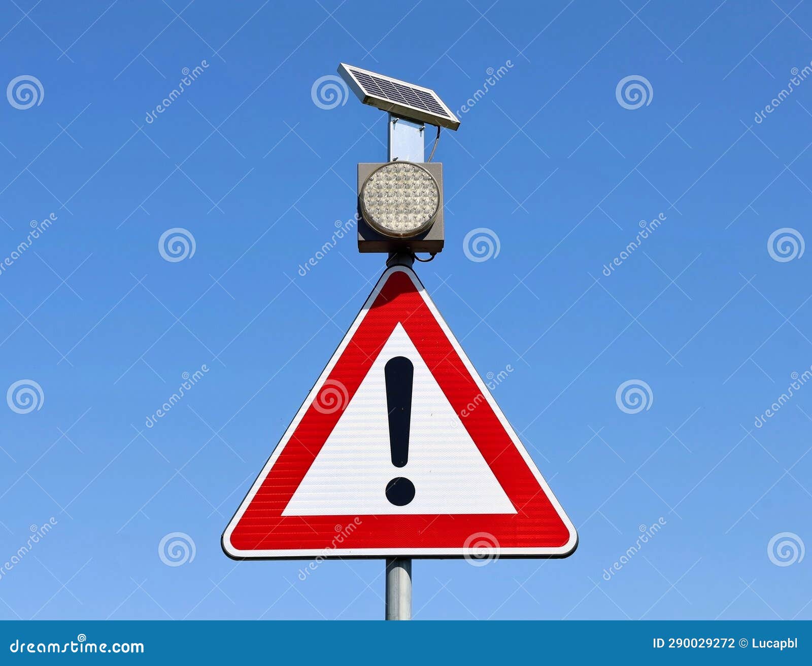 Solar Panel Powered Traffic Warning Light Above a Triangle Warning Sign ...