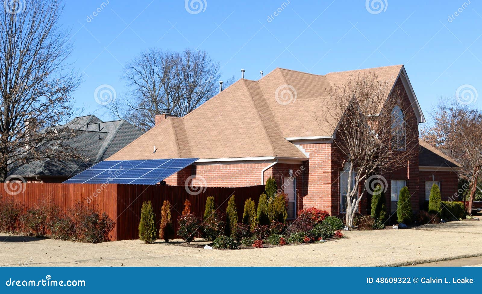 A Solar Panel Powers a Middle Class Suburban Home Stock Photo - Image ...
