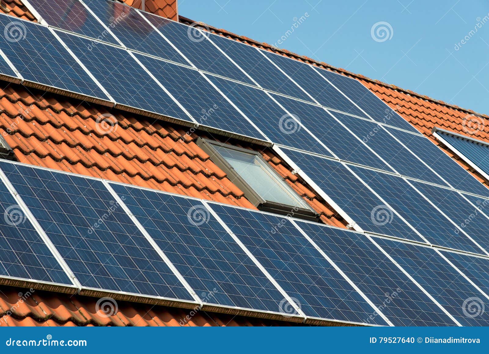 Solar panel on a red roof stock photo. Image of sunlight - 79527640