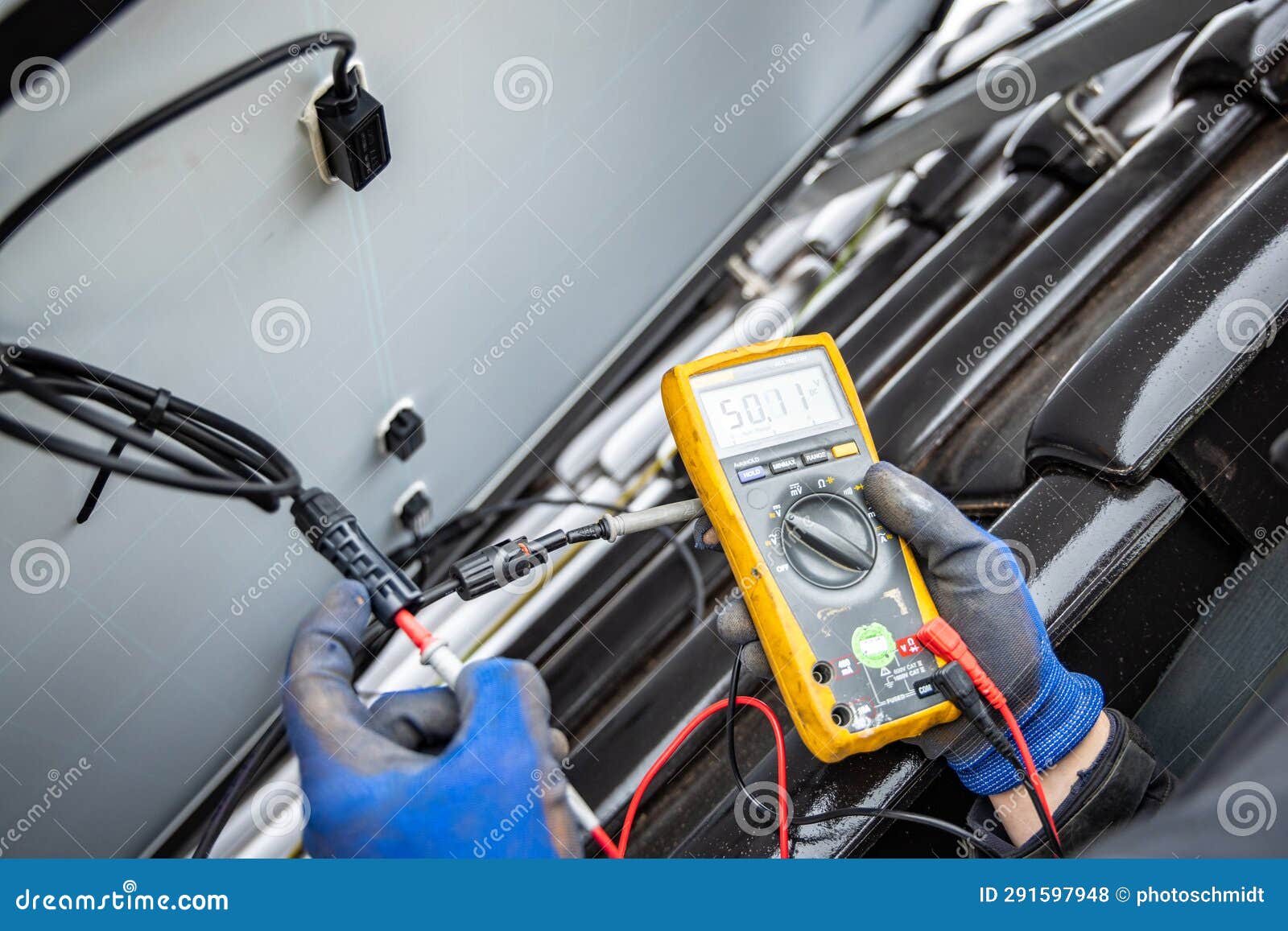 Solar Panel on a Roof Being Tested for Its Power Output Using a ...