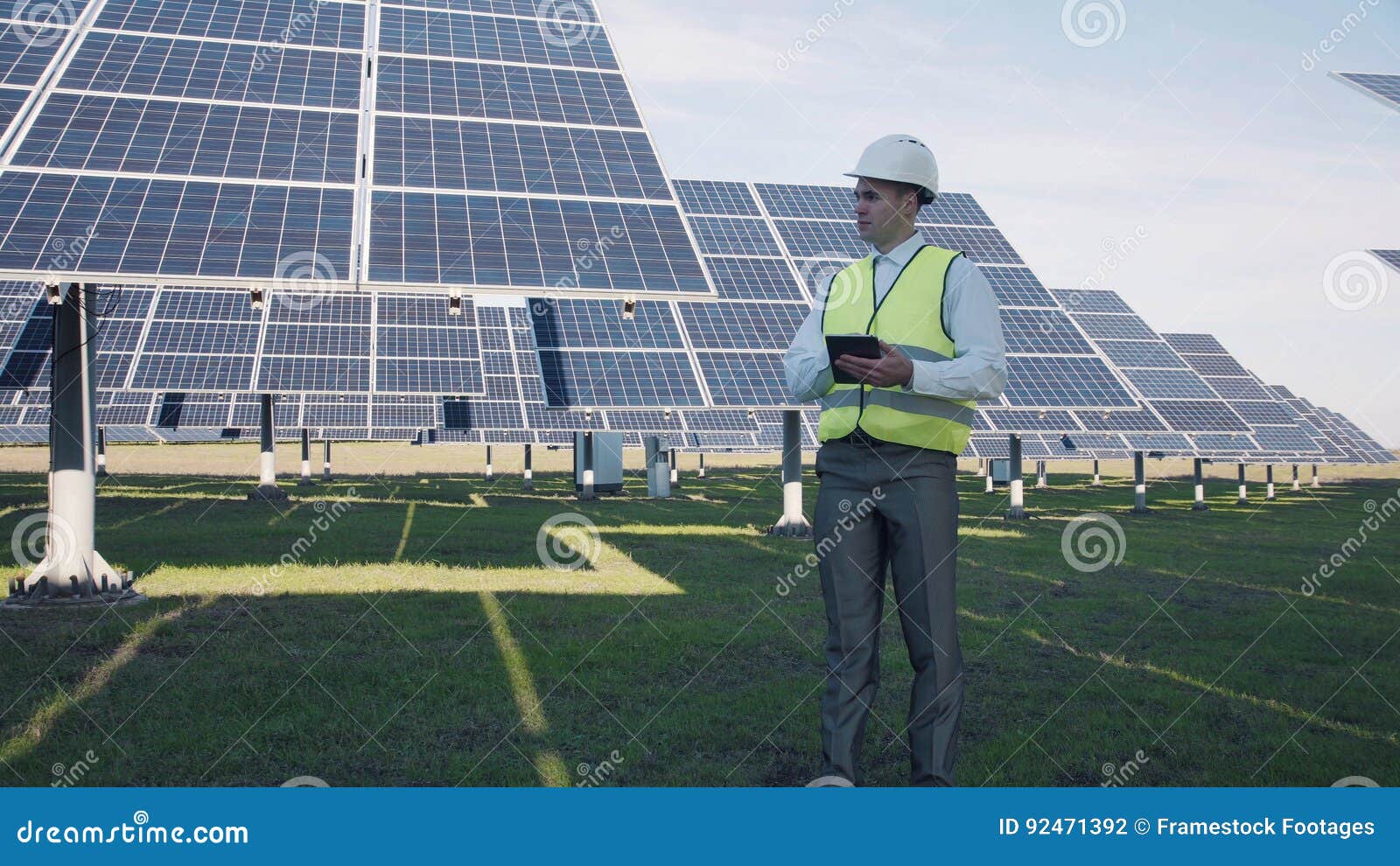 Solar Panel Technician Using Tablet Near Array Stock Photo - Image of ...