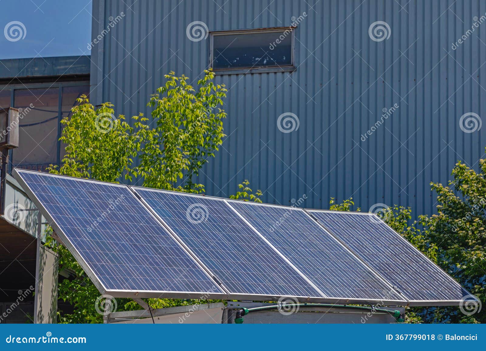Four Solar Panels Are Installed On The Roof Slope Of The House Royalty ...