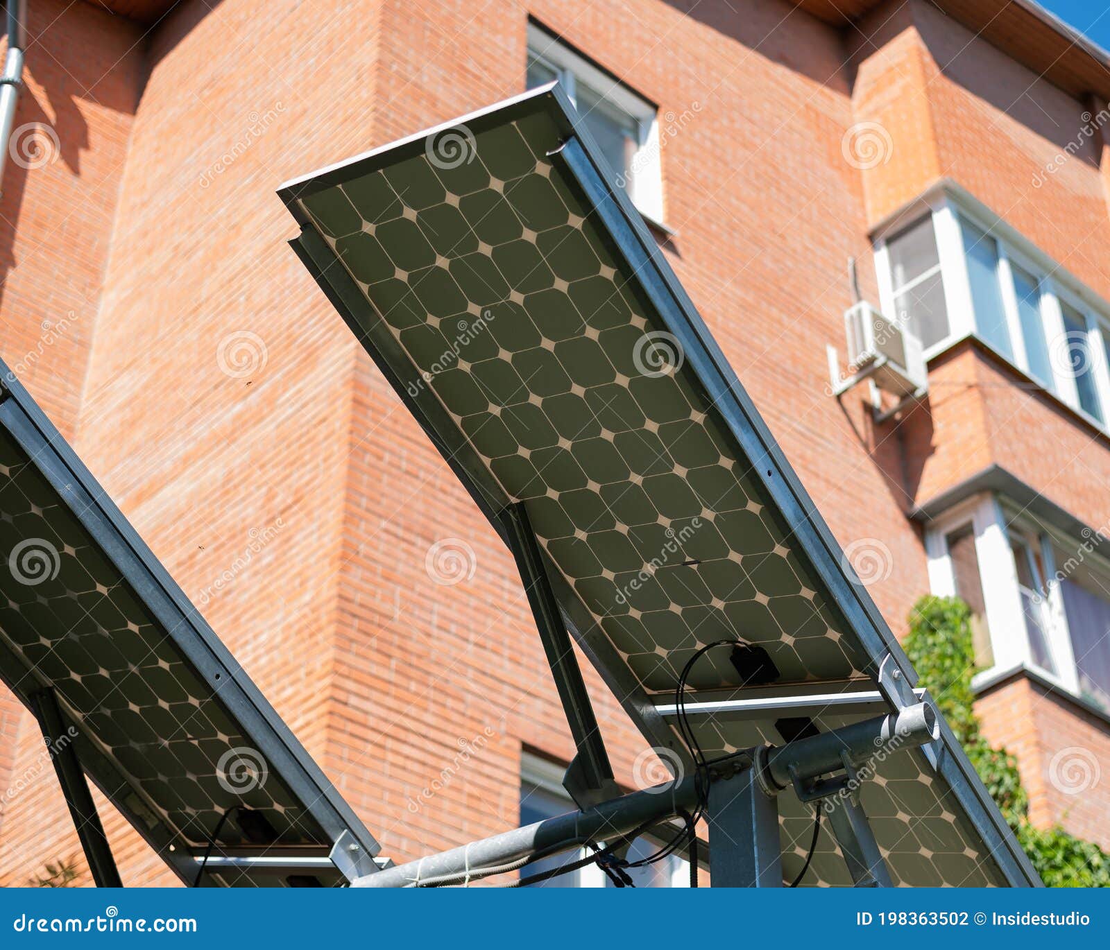 Solar Panels on the Background of a Brick House Stock Photo - Image of ...