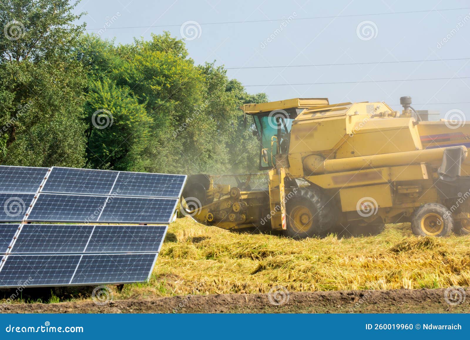 Solar Panels and Combine Harvester Stock Photo - Image of energy ...
