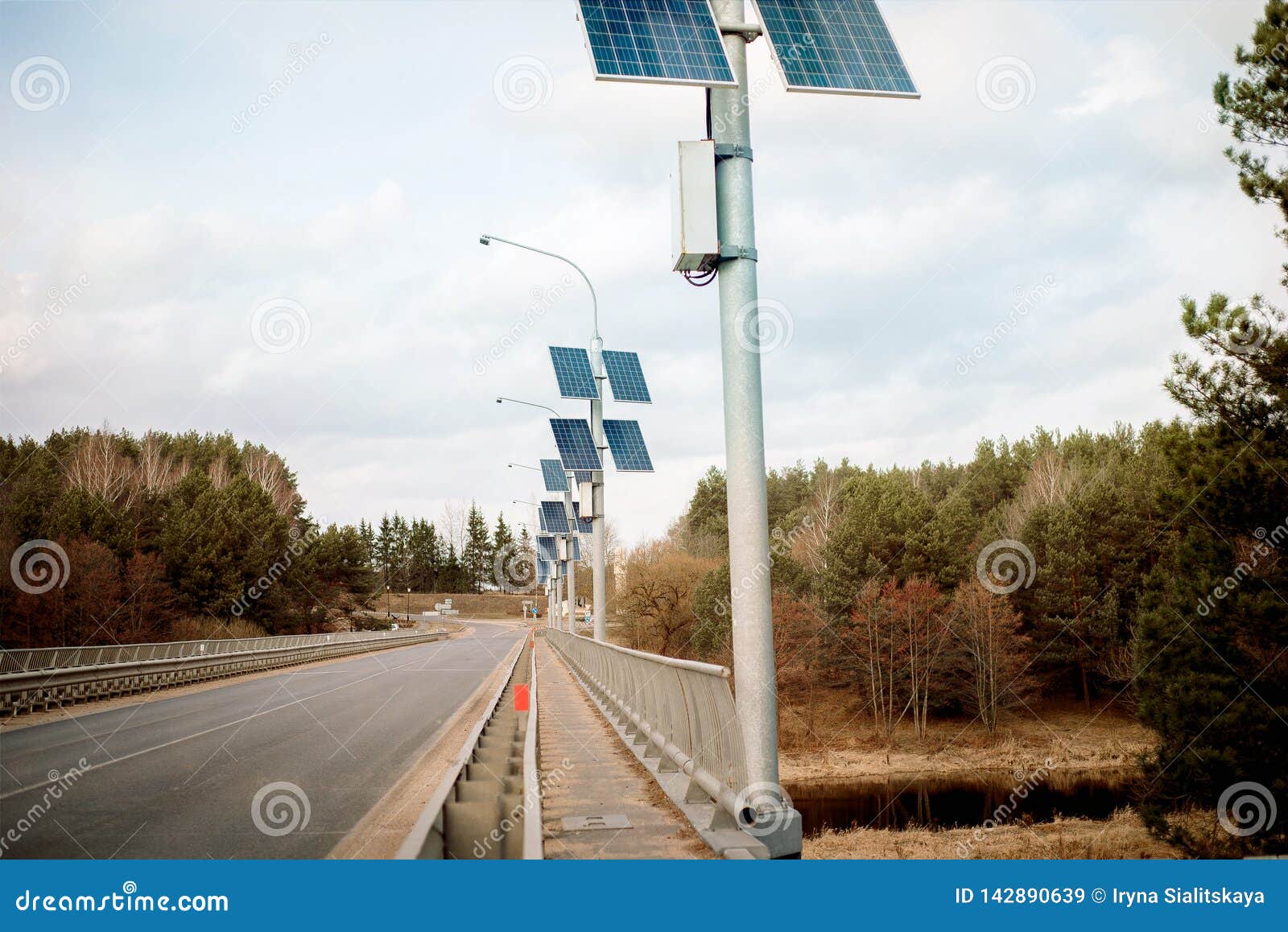 Solar Panels in the Forest. Bridge and River in Spring Stock Image ...