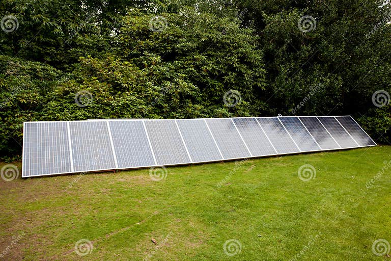 Solar panels in garden stock photo. Image of environmental - 15716206