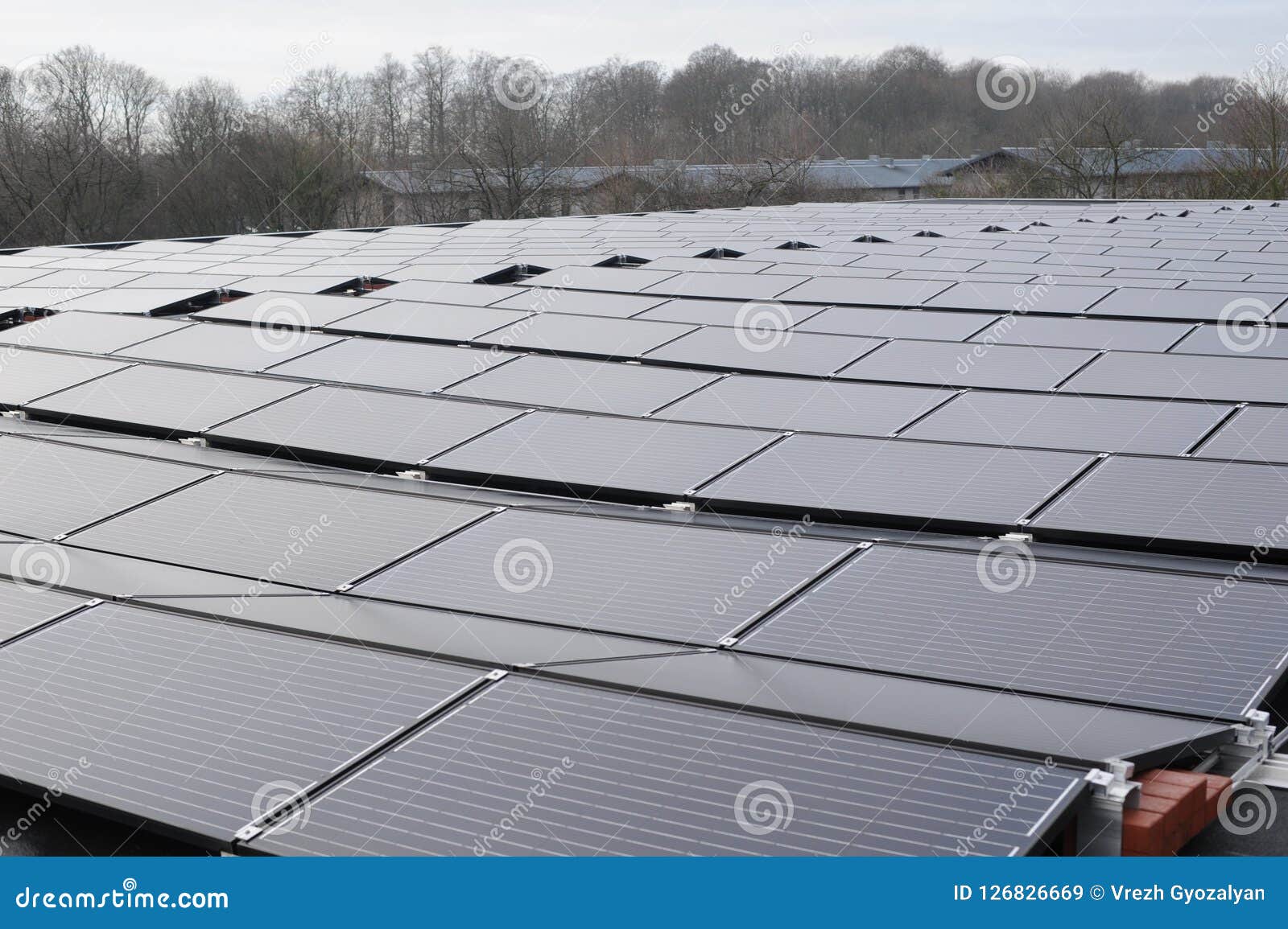 House With Rooftop Solar Panels And Wind Turbines Stock Photo ...