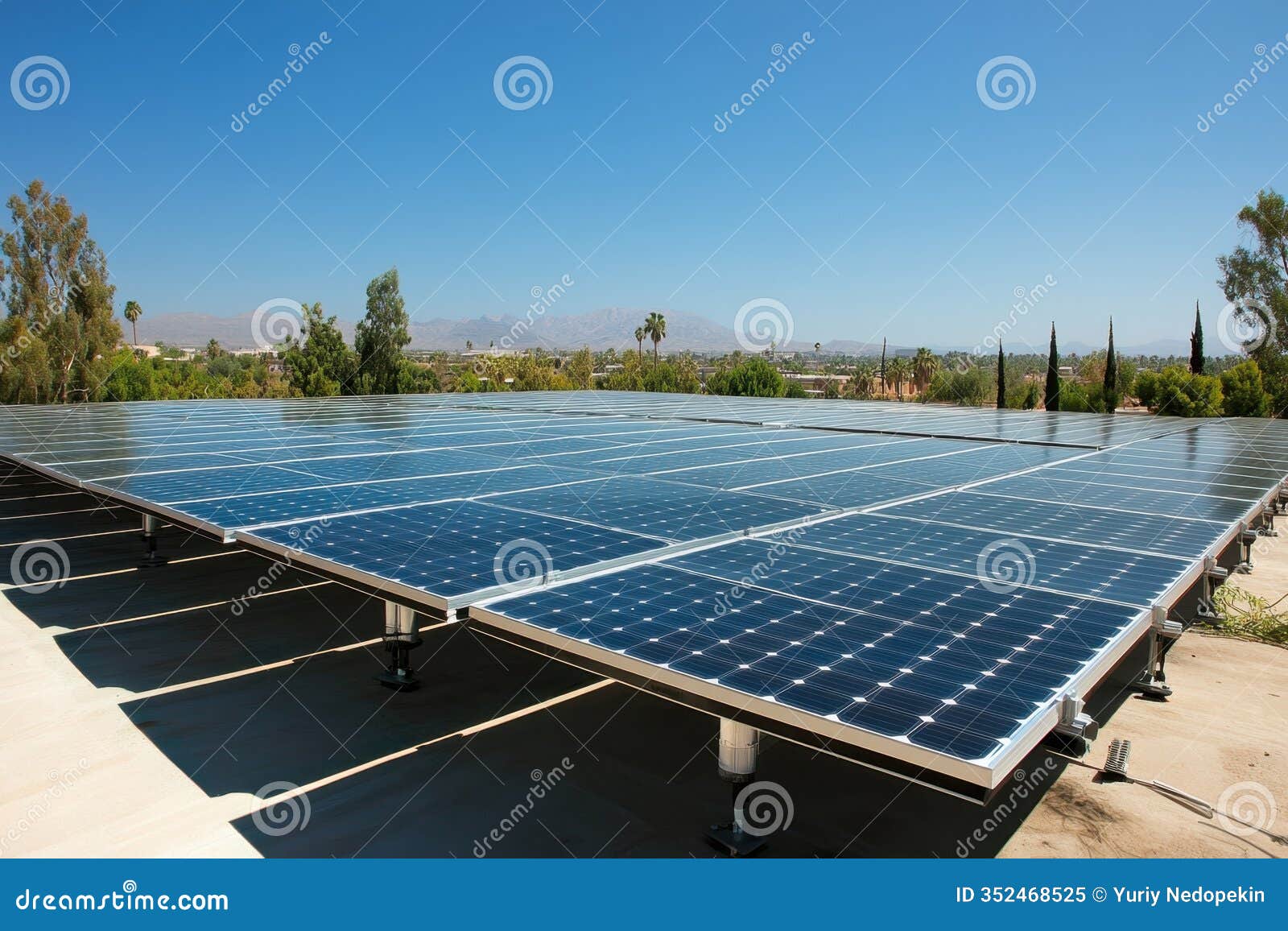 Solar Panels Installed on a Rooftop with Clear Sky and Distant ...
