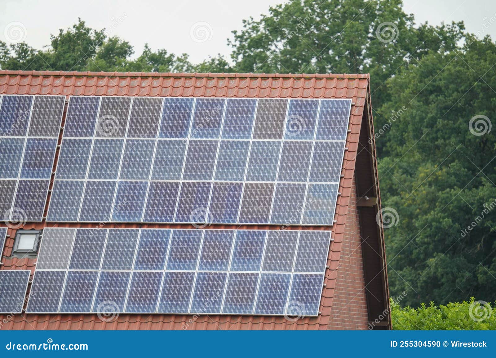 Solar Panels on a Brick Red Roof of a Building Stock Photo - Image of ...