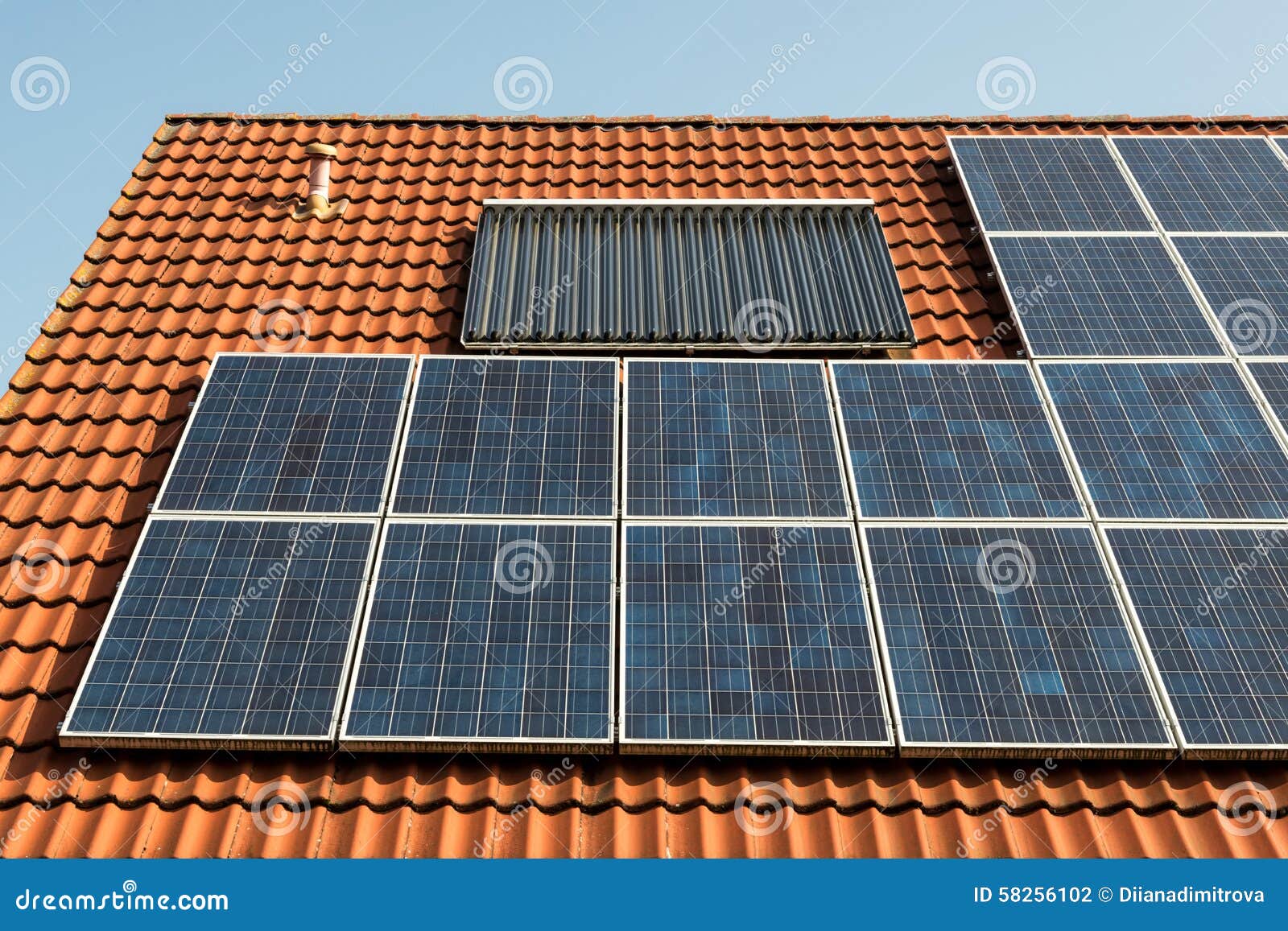 Solar panels on a red roof stock photo. Image of heat - 58256102