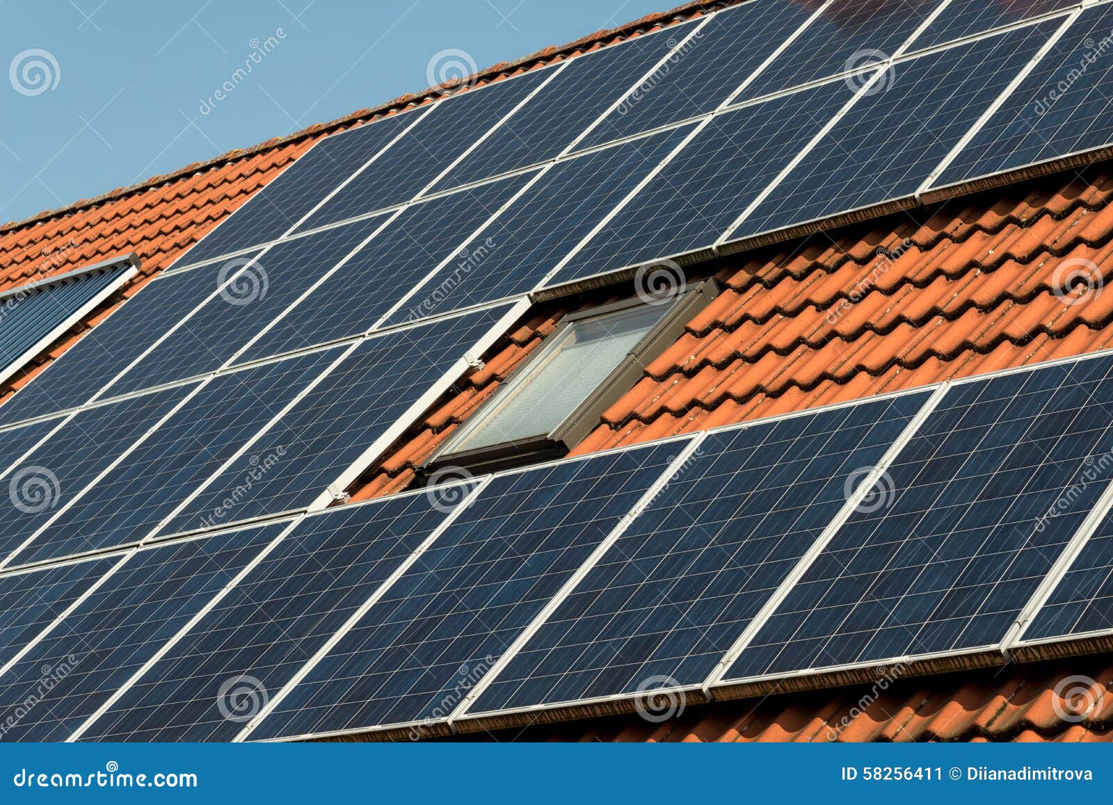 Solar panels on a red roof stock image. Image of energy - 58256411