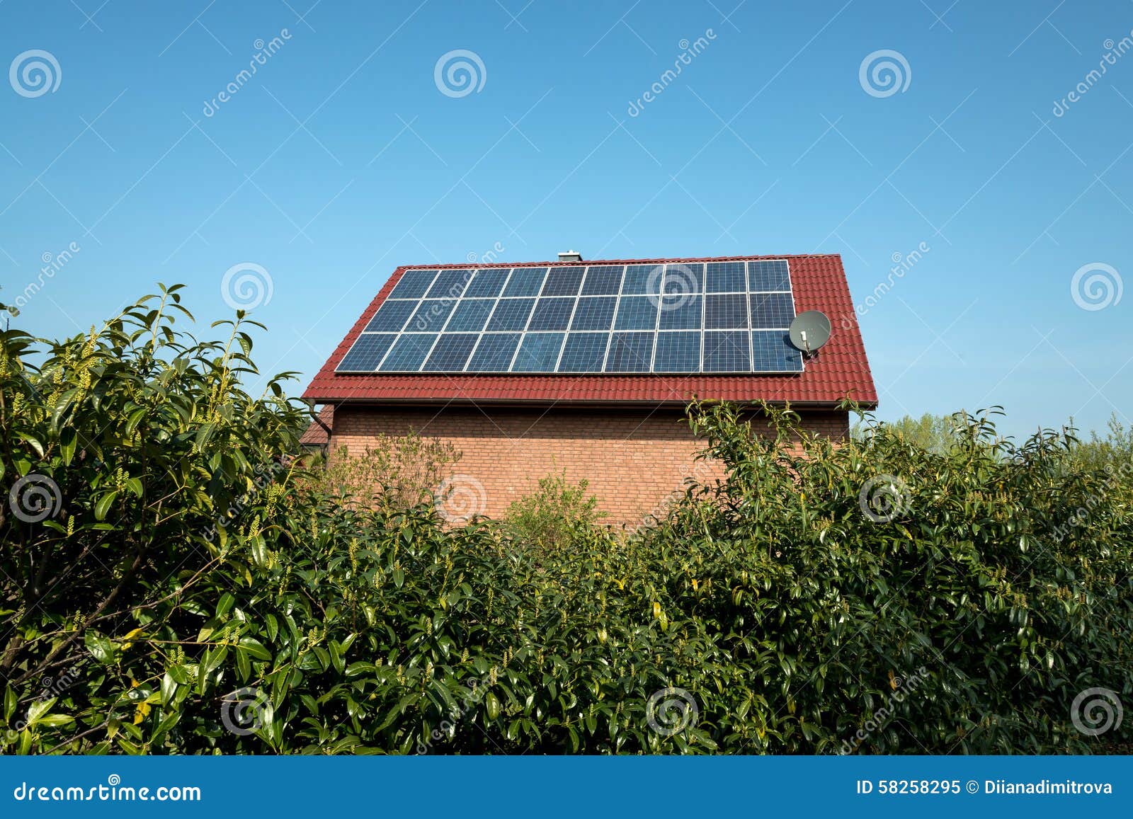 Solar panels on a red roof stock image. Image of house - 58258295