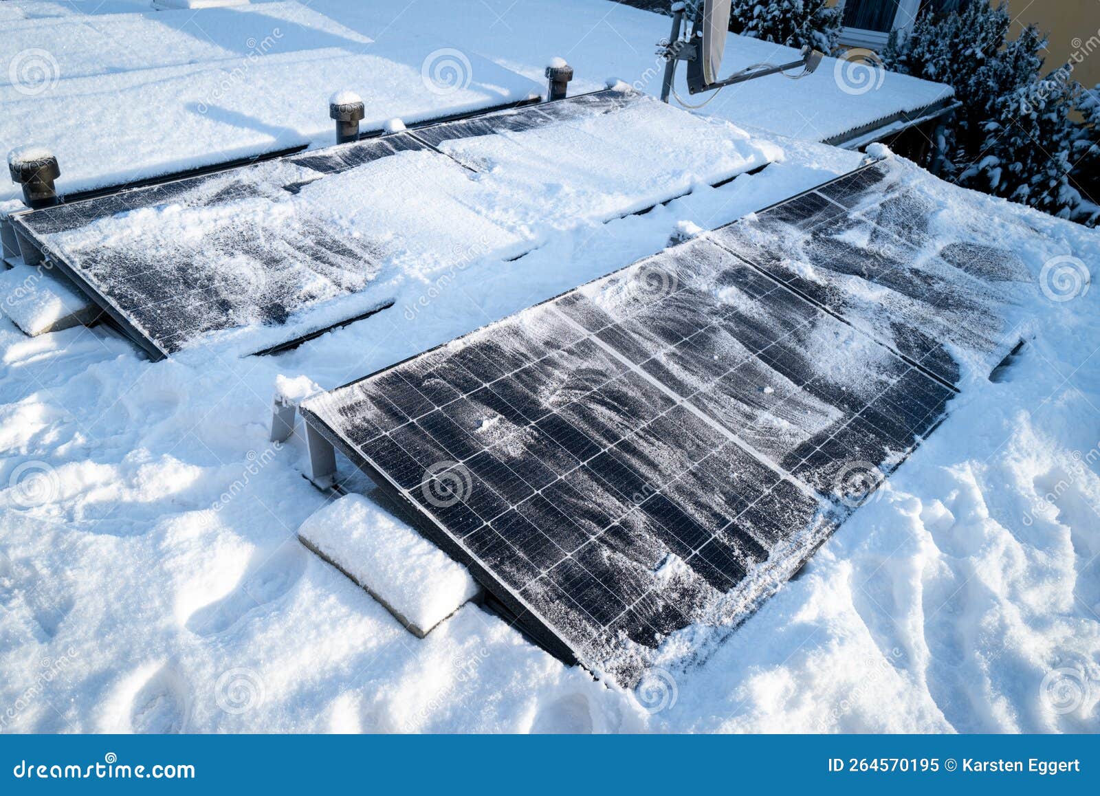 Solar Panels on the Roof are Cleaned from Snow with the Broom Stock ...