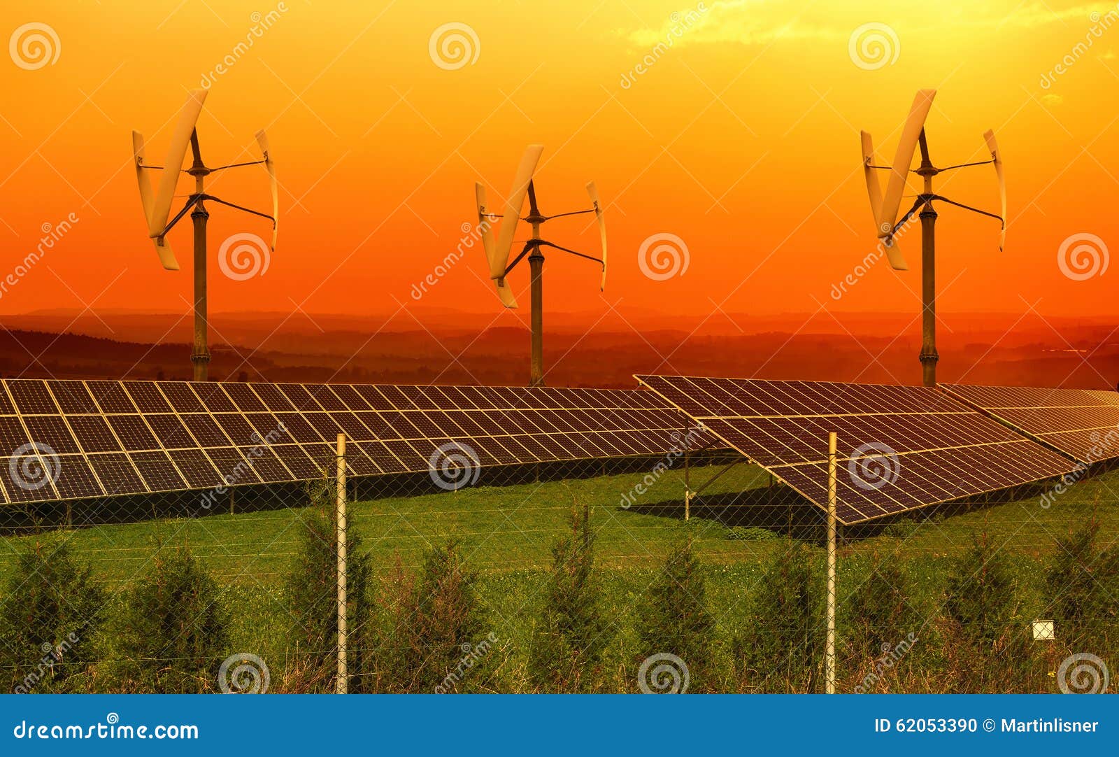Solar Panels with Small Wind Turbines in the Sunset Stock Photo - Image ...