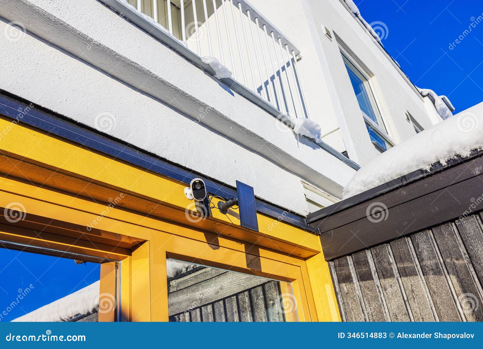 Solar-powered Security Camera Mounted on Yellow Wall Villa with Solar ...
