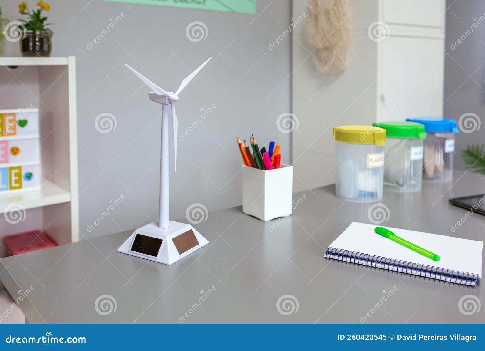 Solar Windmill and Selective Trash Bins Over Desk in Classroom Stock ...