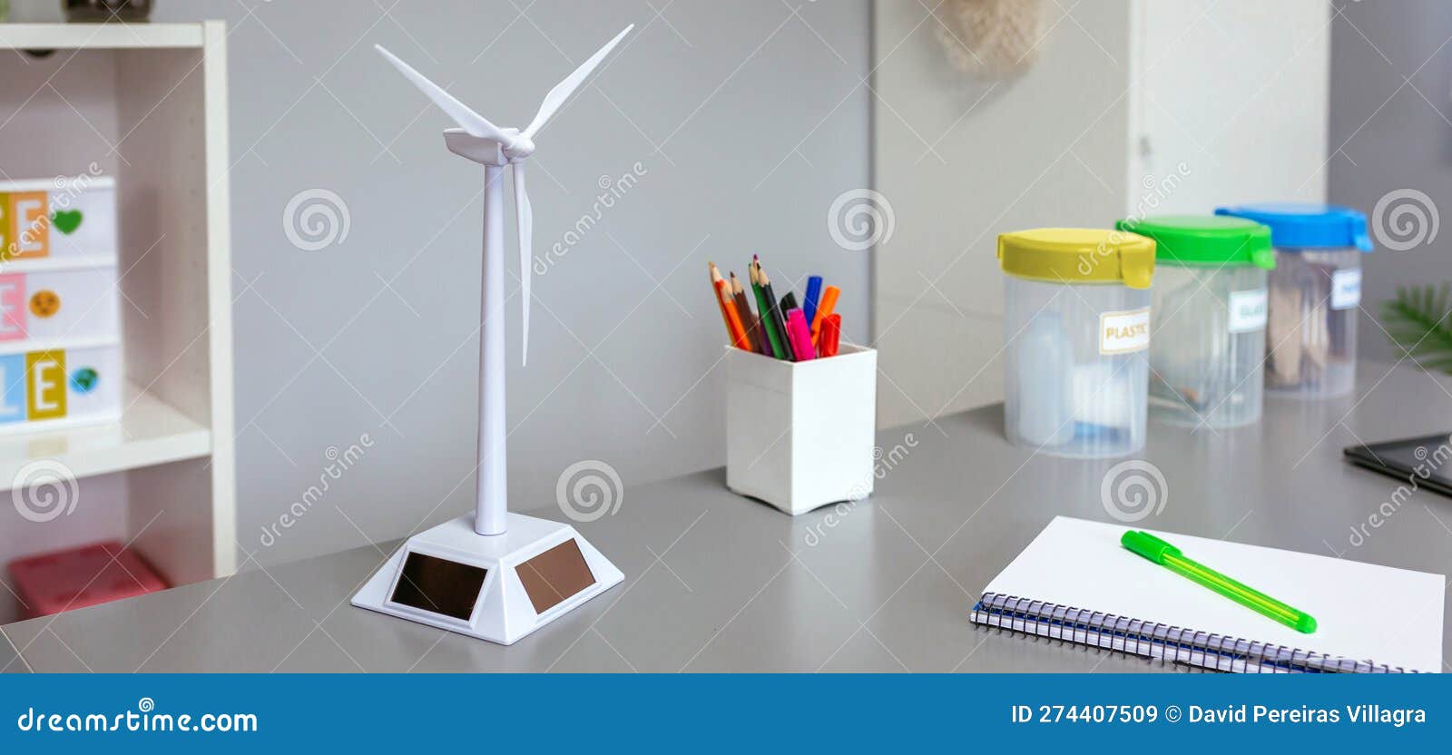 Solar Windmill and Selective Trash Bins Over Desk in Classroom Stock ...