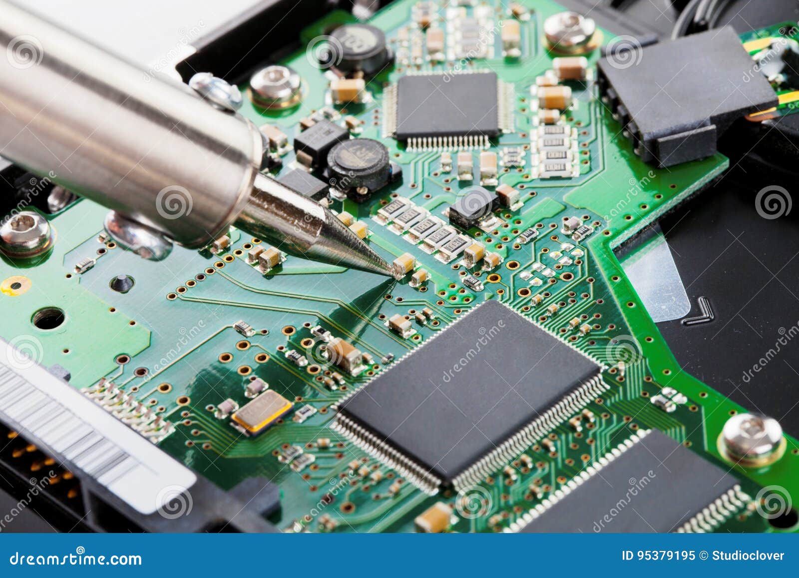 Soldering Iron and Microcircuit - Close Up Studio Shot. Filtered Image ...