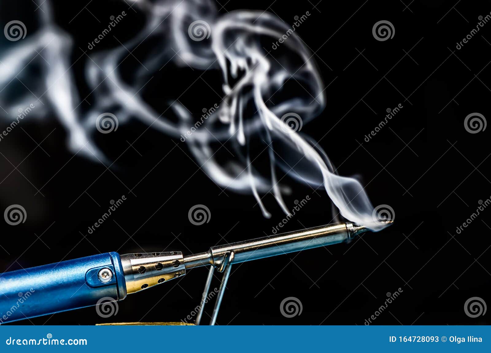 Soldering Iron with Smoke on a Black Background. Electrical Stock Image ...