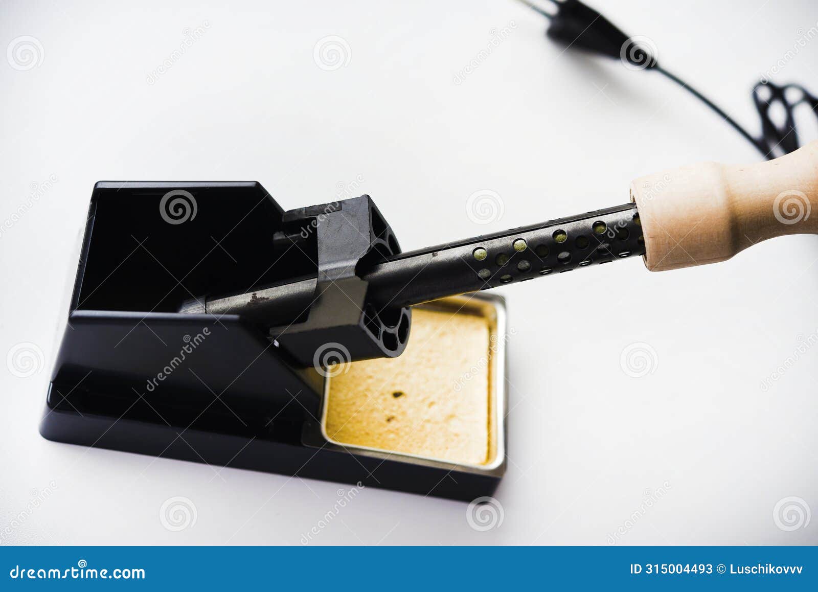 Soldering Iron with a Wooden Handle in the Holder. a Soldering Iron ...