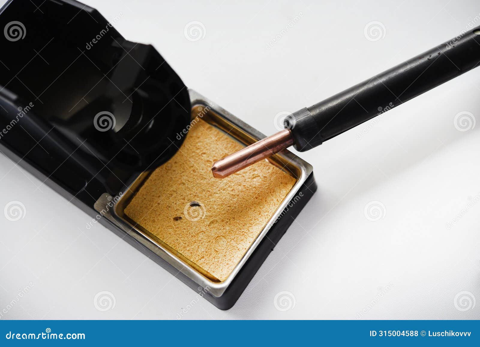 Soldering Iron with a Wooden Handle in the Holder. a Soldering Iron ...