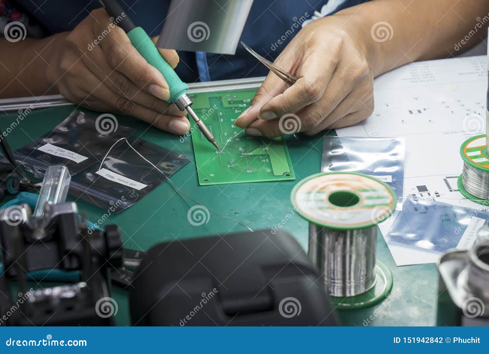 The Soldering Operator Repair the Electronics Circuit Board. Stock ...