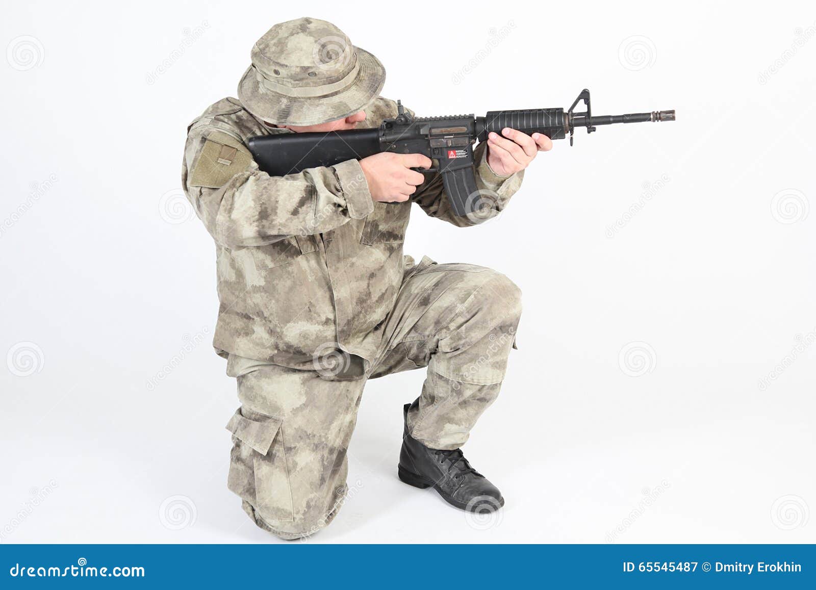 A soldier aiming stock image. Image of protection, automatic - 65545487