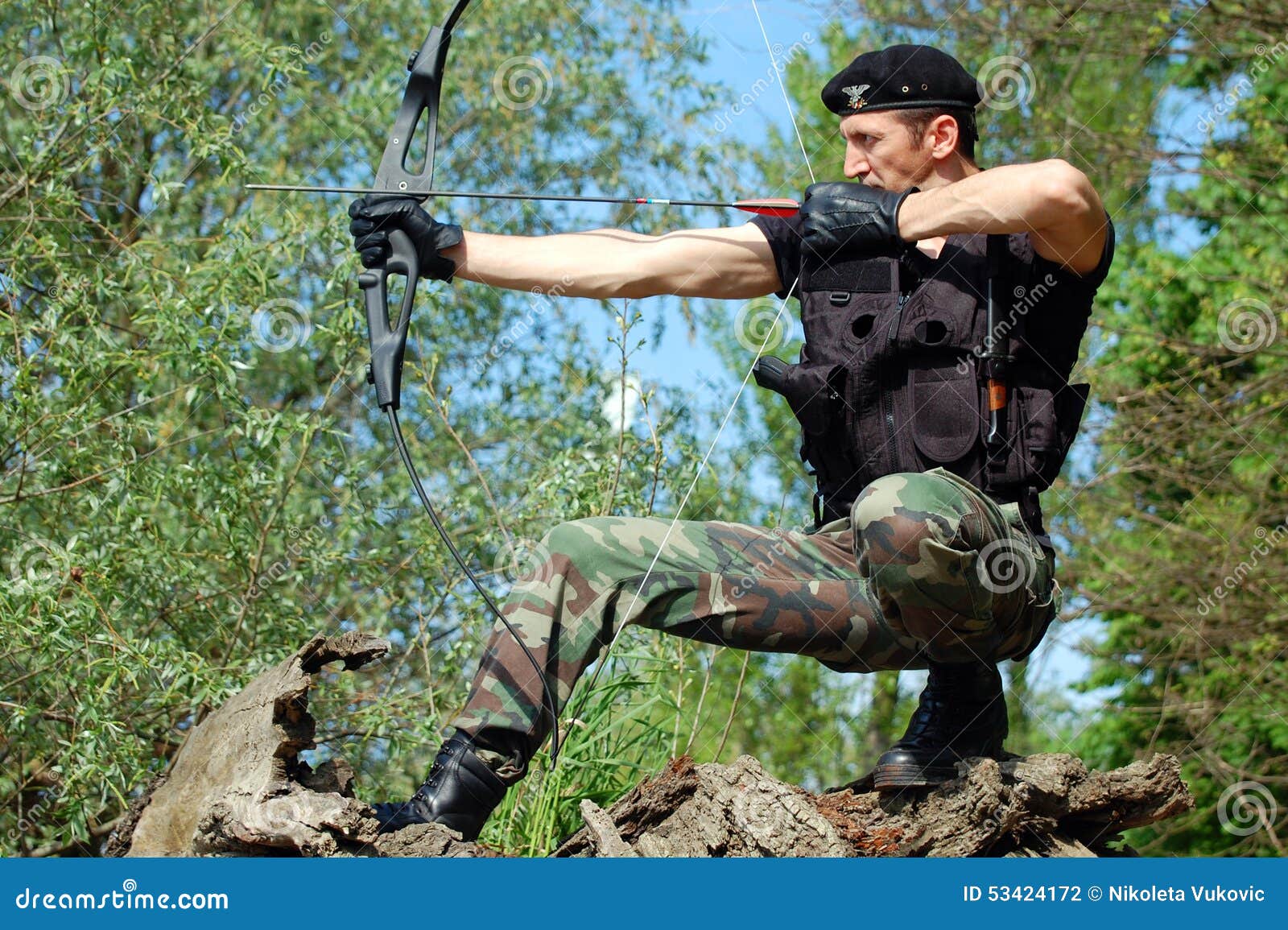 Soldier with bow and arrow stock photo. Image of sunny - 53424172