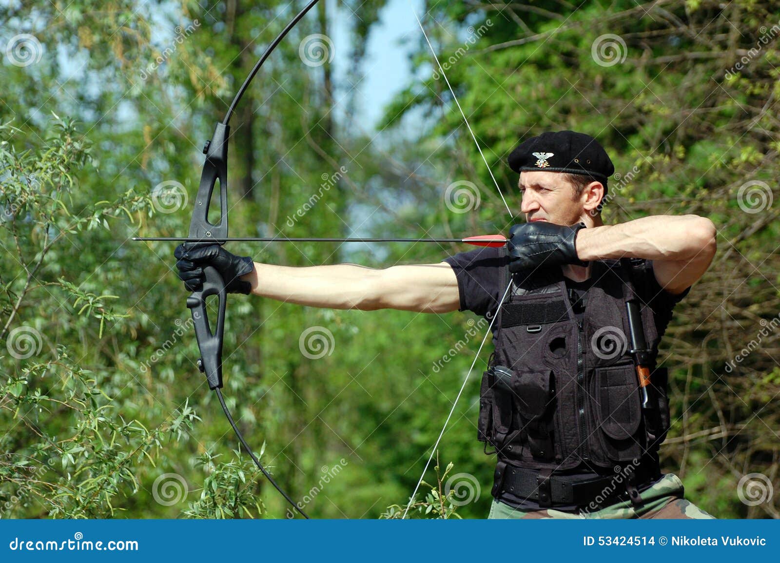 Soldier with bow and arrow stock photo. Image of sunny - 53424514
