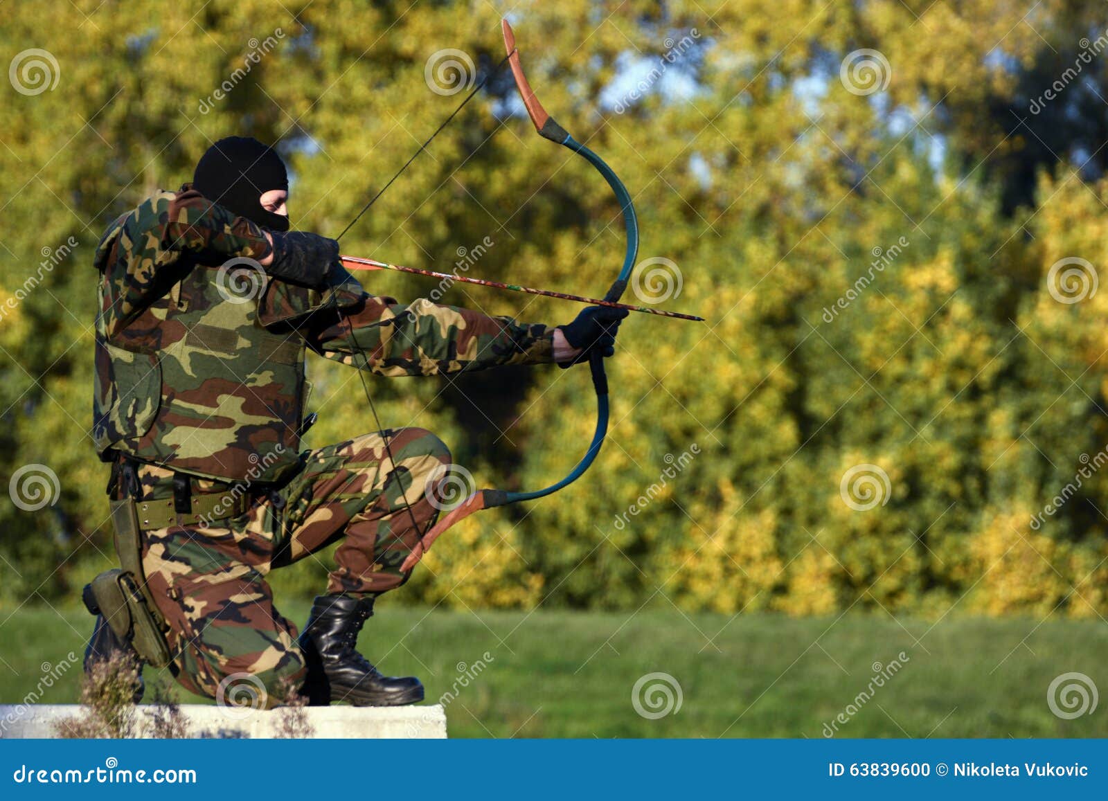 Soldier with bow and arrow stock photo. Image of nature - 63839600