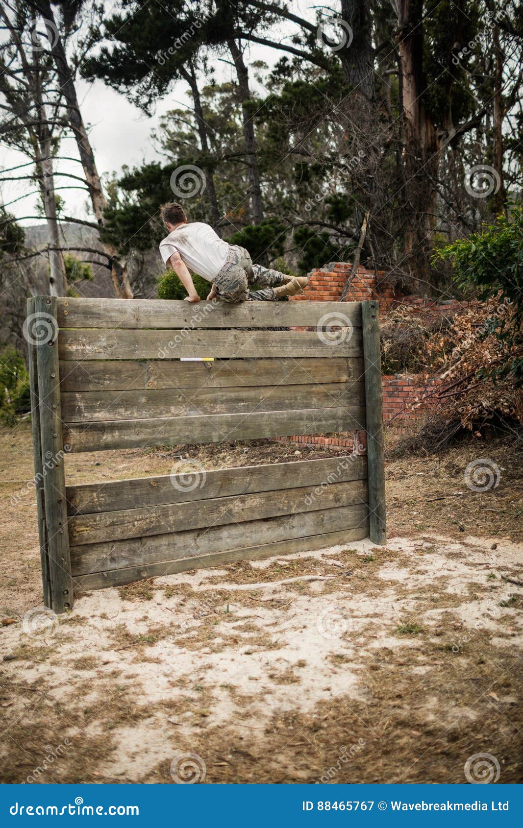 Soldier Climbing Wooden Wall in Boot Camp Stock Image - Image of ...