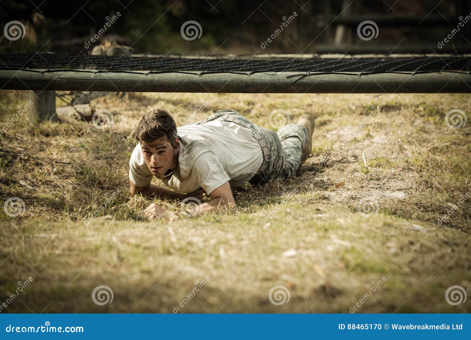 Soldier Crawling Under the Net during Obstacle Course Stock Photo ...