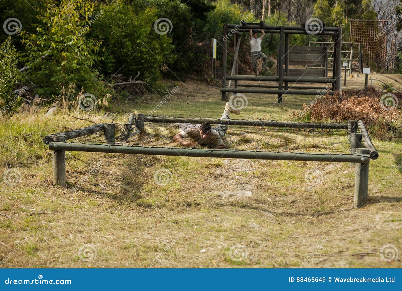 Soldier Crawling Under the Net during Obstacle Course Stock Image ...