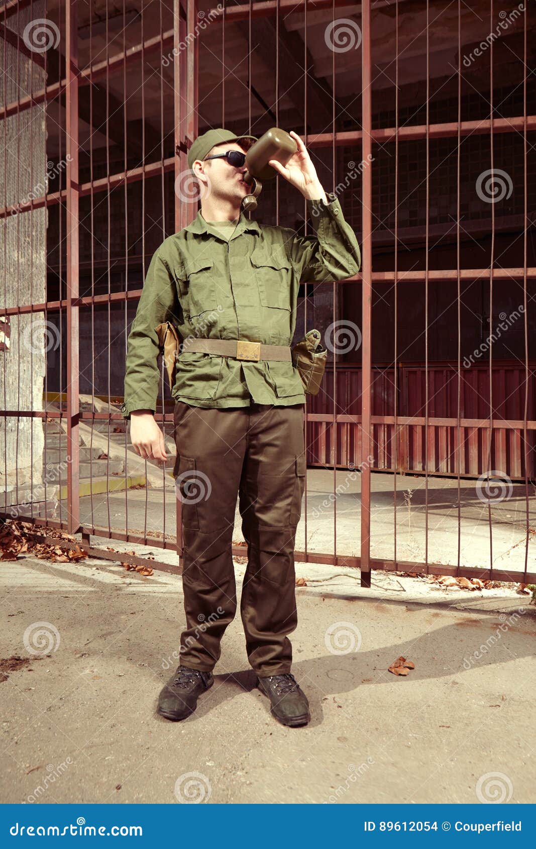 Soldier Drinking from Field Bottle Stock Photo - Image of city, field ...