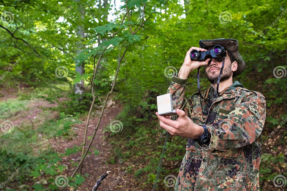 Soldier Exploring Forest Using Binoculars and Compass for Navigation ...