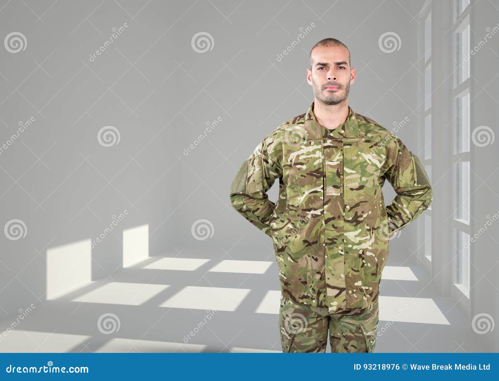 Soldier with His Hands on Back. Concrete Room with Windows Stock ...