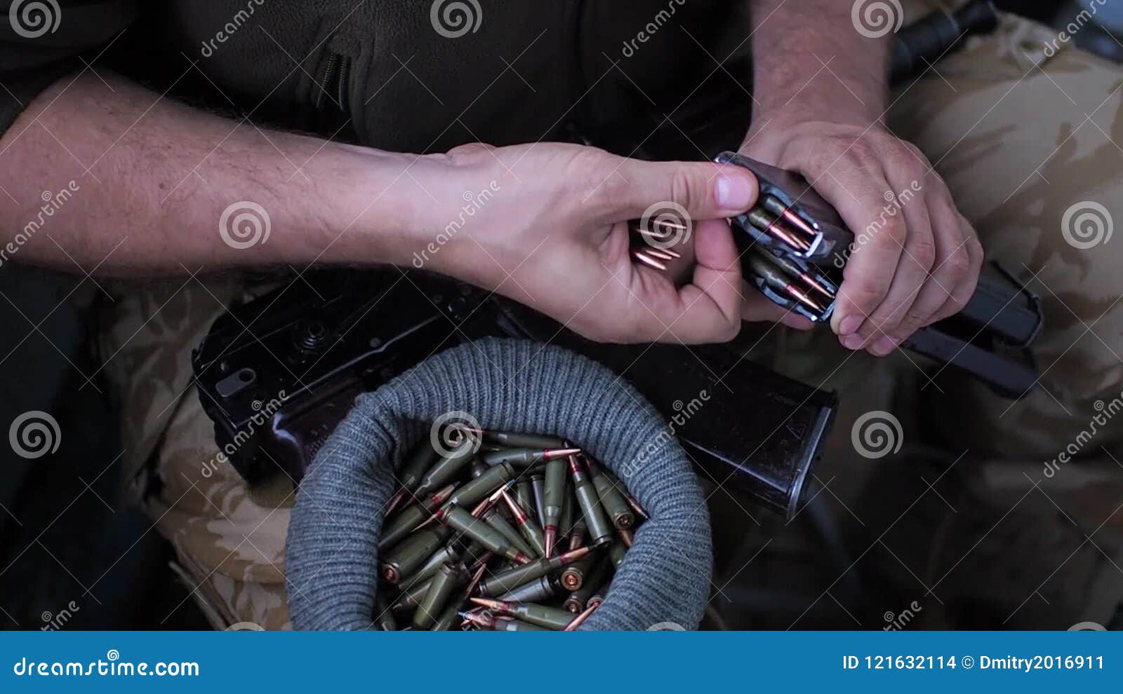 Soldier Loading a Bunch of Bullets into a Handgun Magazine. Stock ...