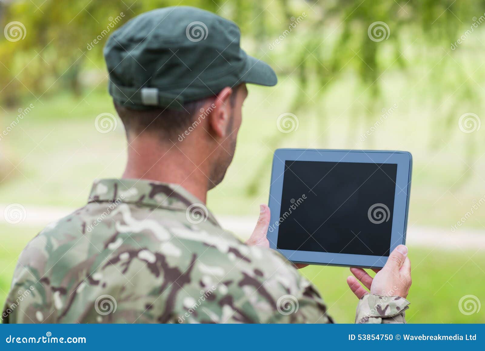 Soldier Looking at Tablet Pc in Park Stock Photo - Image of nature ...