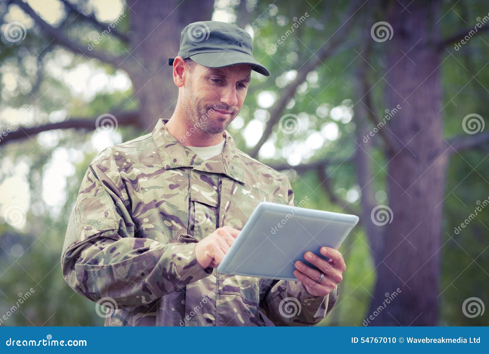 Soldier Looking at Tablet Pc in Park Stock Photo - Image of nature ...