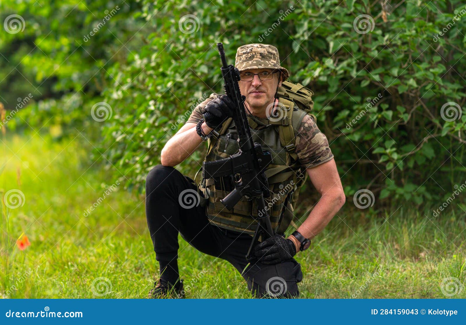 Soldier or Mercenary Crouching on One Leg, Looking at the Camera Stock ...