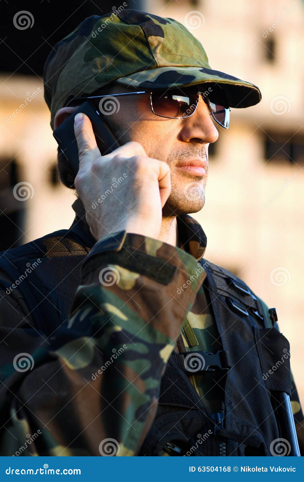 Soldier with phone stock photo. Image of uniform, soldier - 63504168