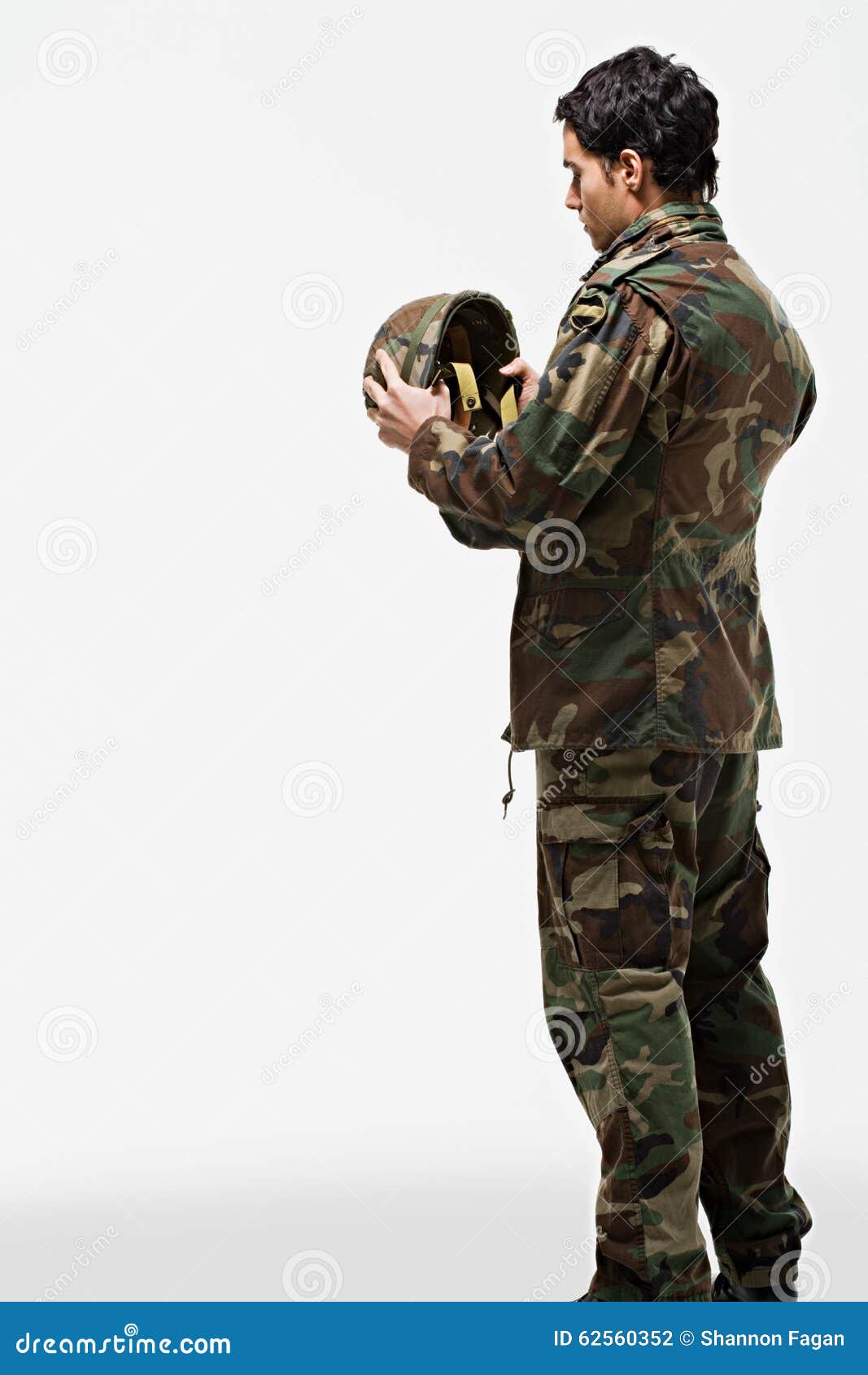 Soldier putting on helmet stock photo. Image of ethnicity - 62560352