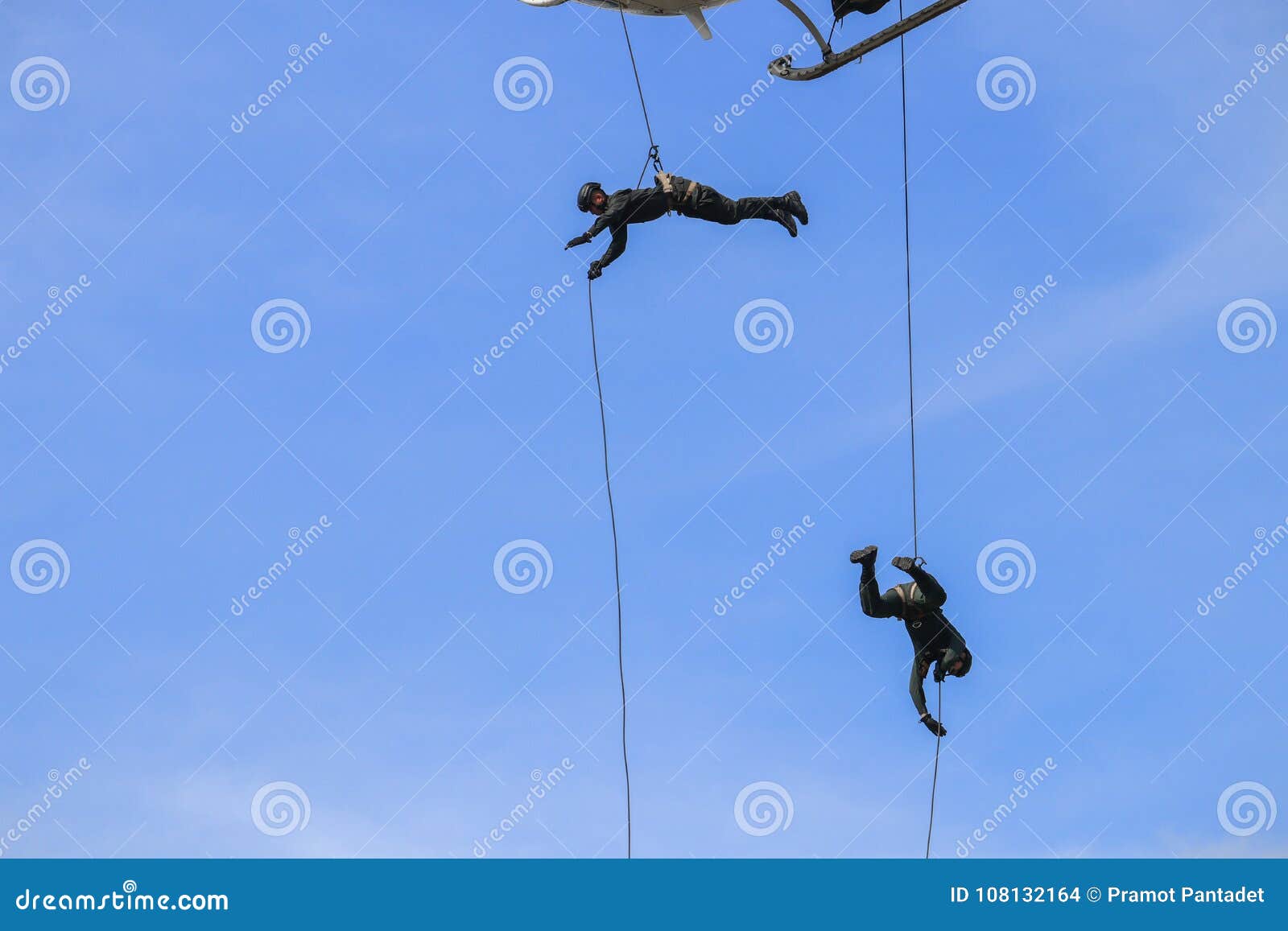 Soldier Rappelling from Helicopter in Blue Sky Editorial Stock Image ...