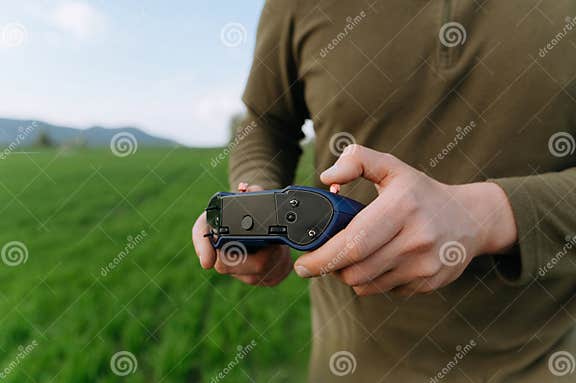 A Soldier Remote Controls a Drone. Control Panel in Hand Stock Image ...