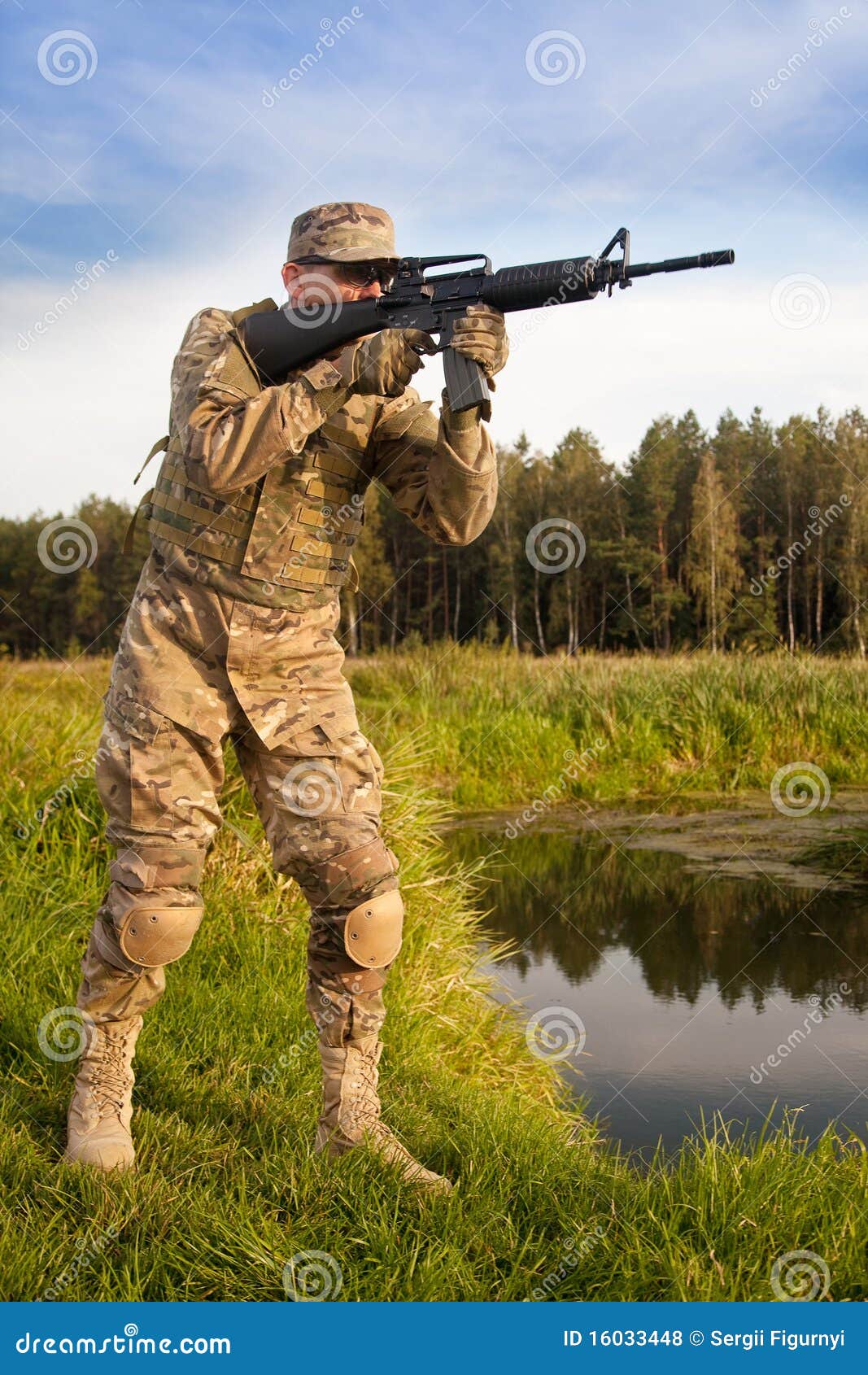 Soldier with a rifle stock photo. Image of river, cloud - 16033448